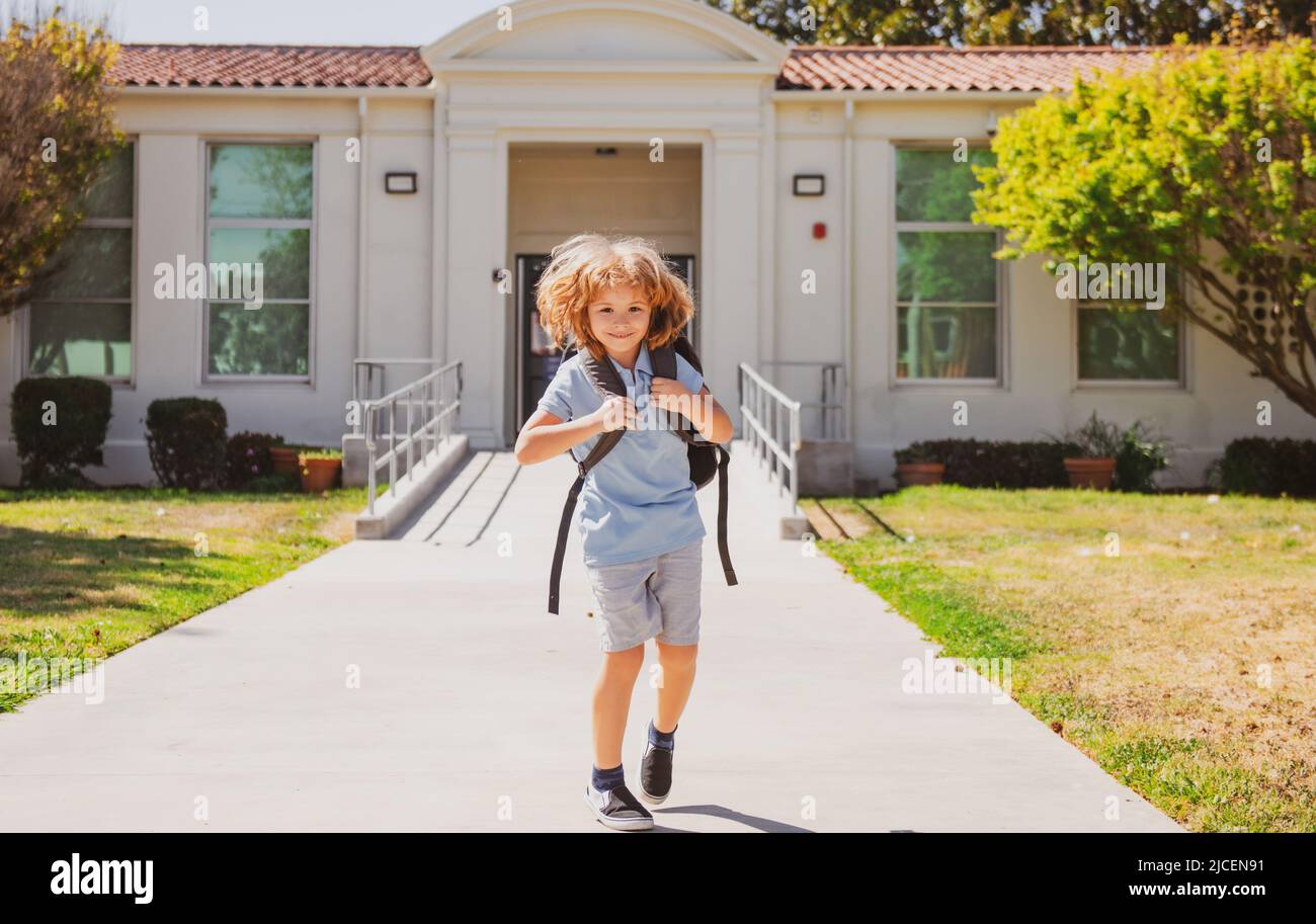 Kids education concept. Excited school kid running at school. The ...