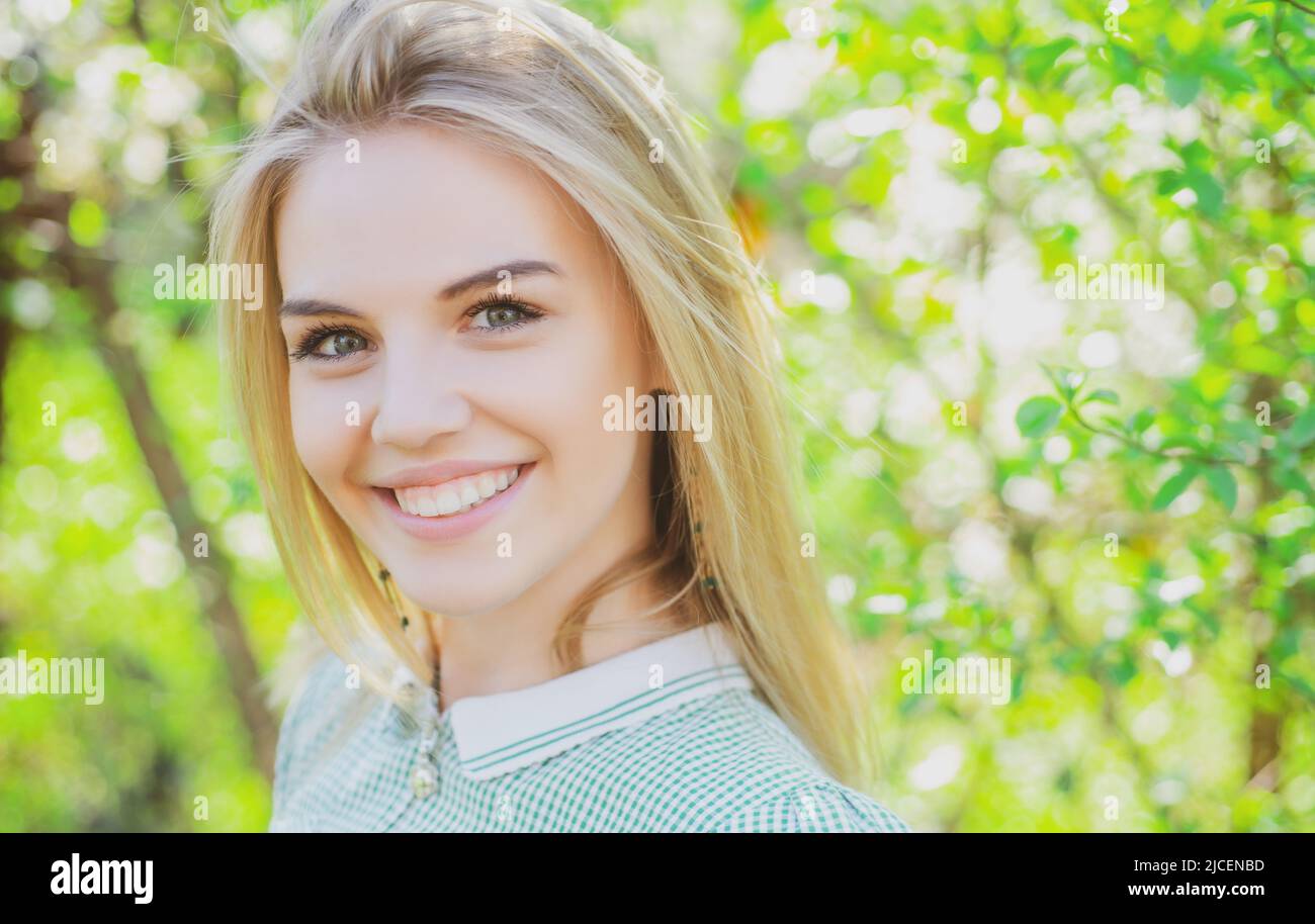 Cute young spring woman girl with blossom background. Smiling summer ...
