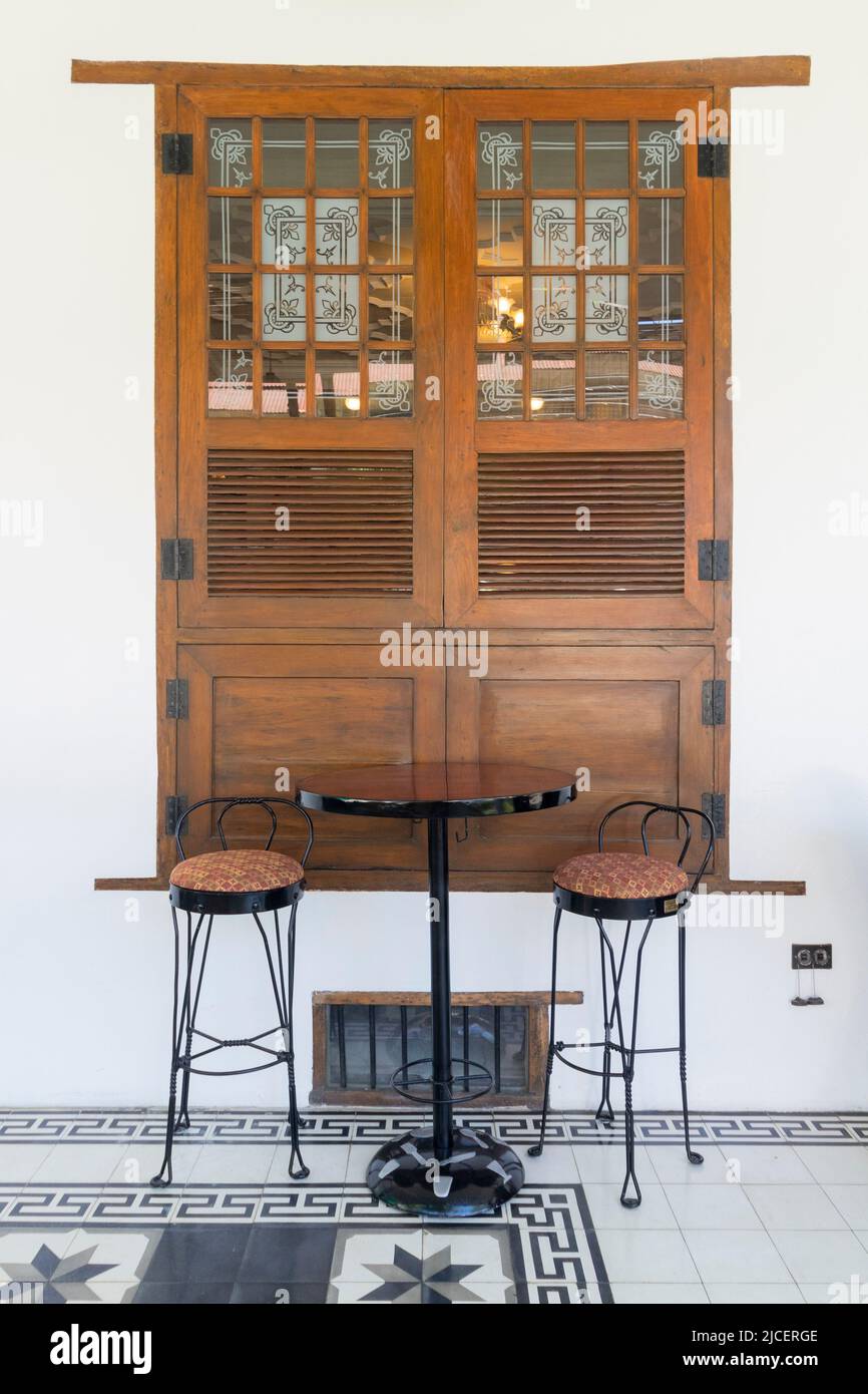 Large window with table and stools at a restaurant cafe in Vigan City ...
