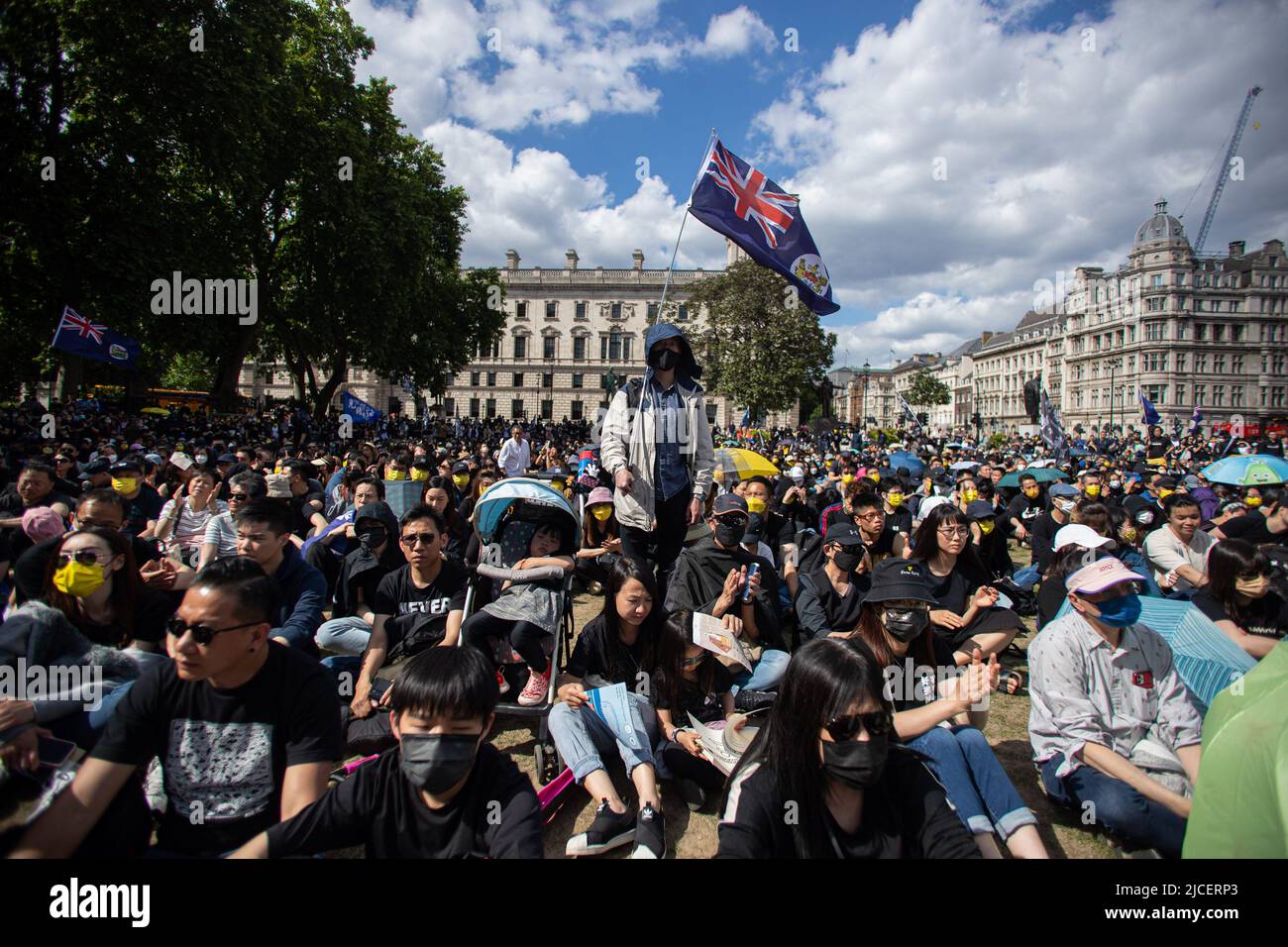 Pro-democracy demonstrator holds Union Jack flag during a rally at ...