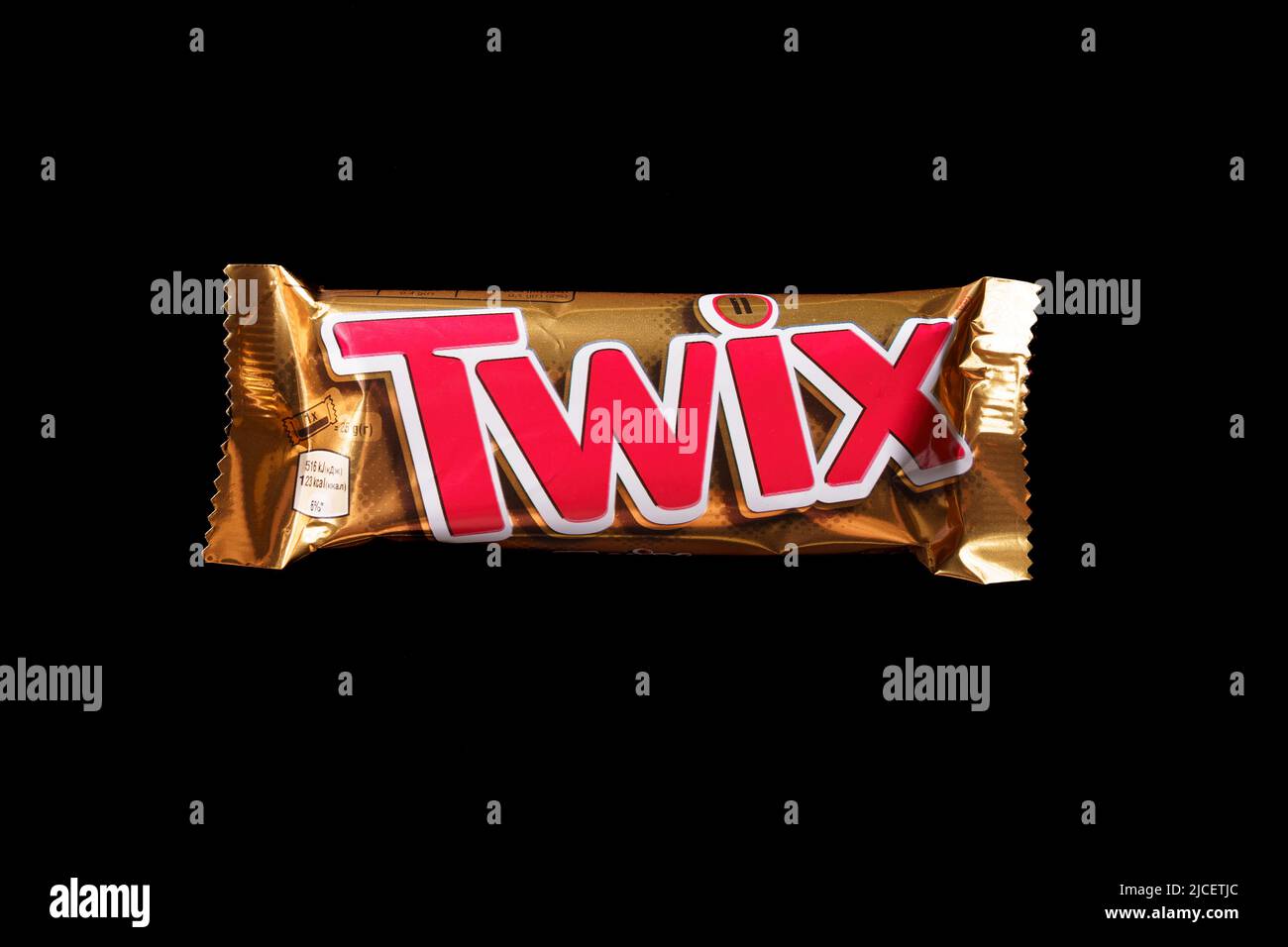 Chocolate bar Twix on a black background, top view Stock Photo - Alamy