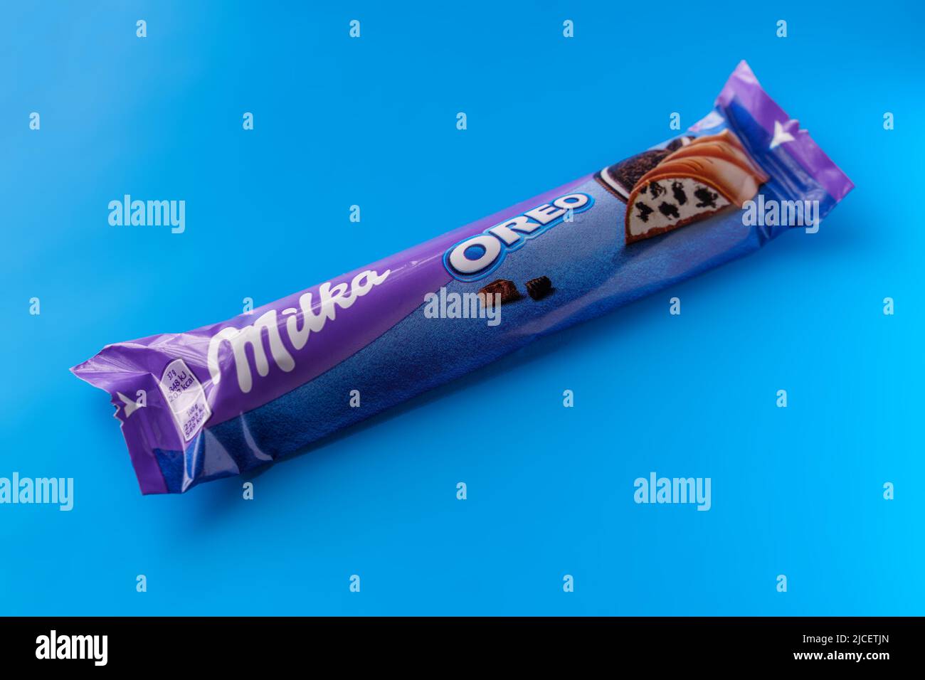 Milka chocolate bar on blue background, soft focus Stock Photo - Alamy