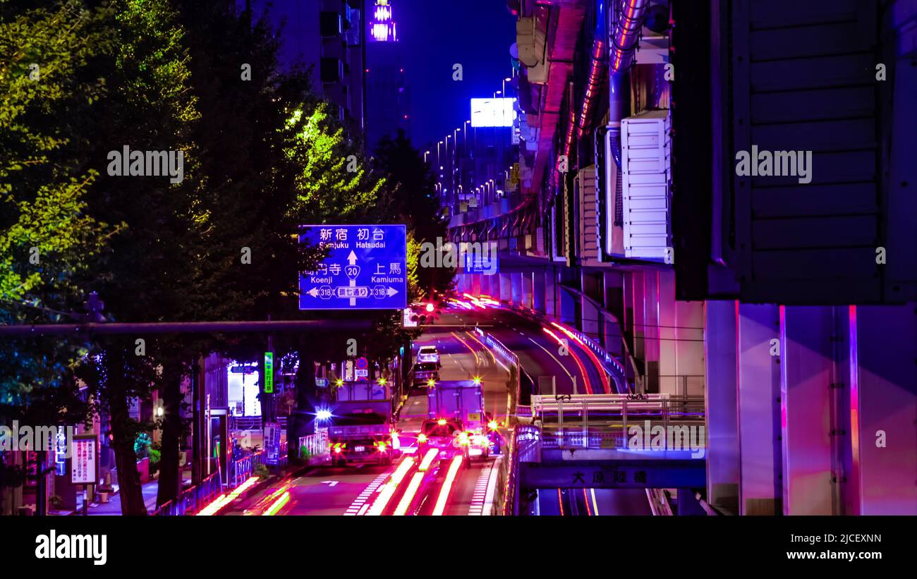 A night timelapse of the city street in Tokyo long shot tilt Stock ...