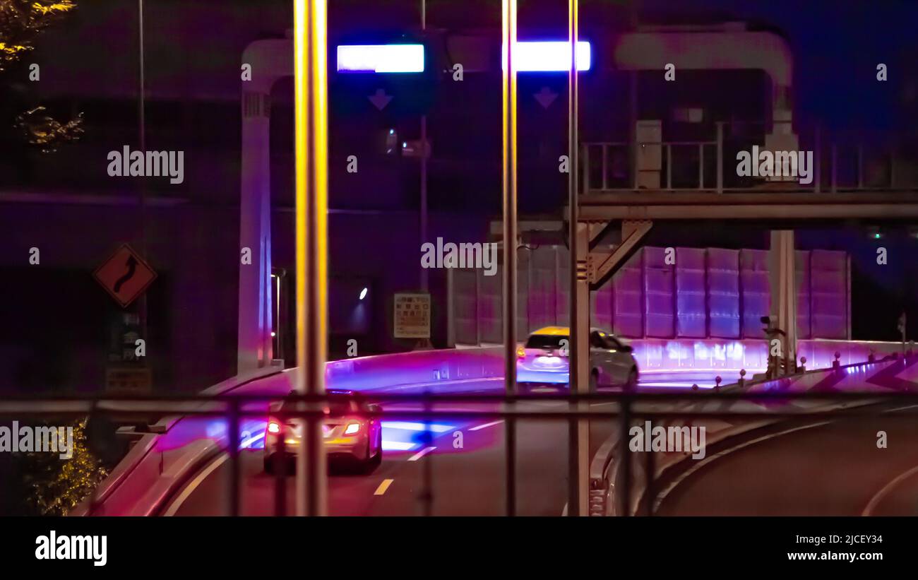 A night timelapse of the urban city street on the highway in Shinjuku ...