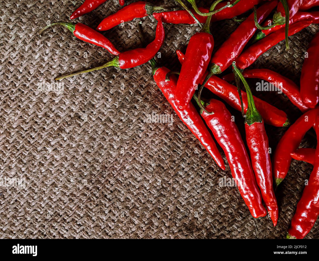 Fresh red chili peppers on vintage cloth background. fresh Red chilli ...