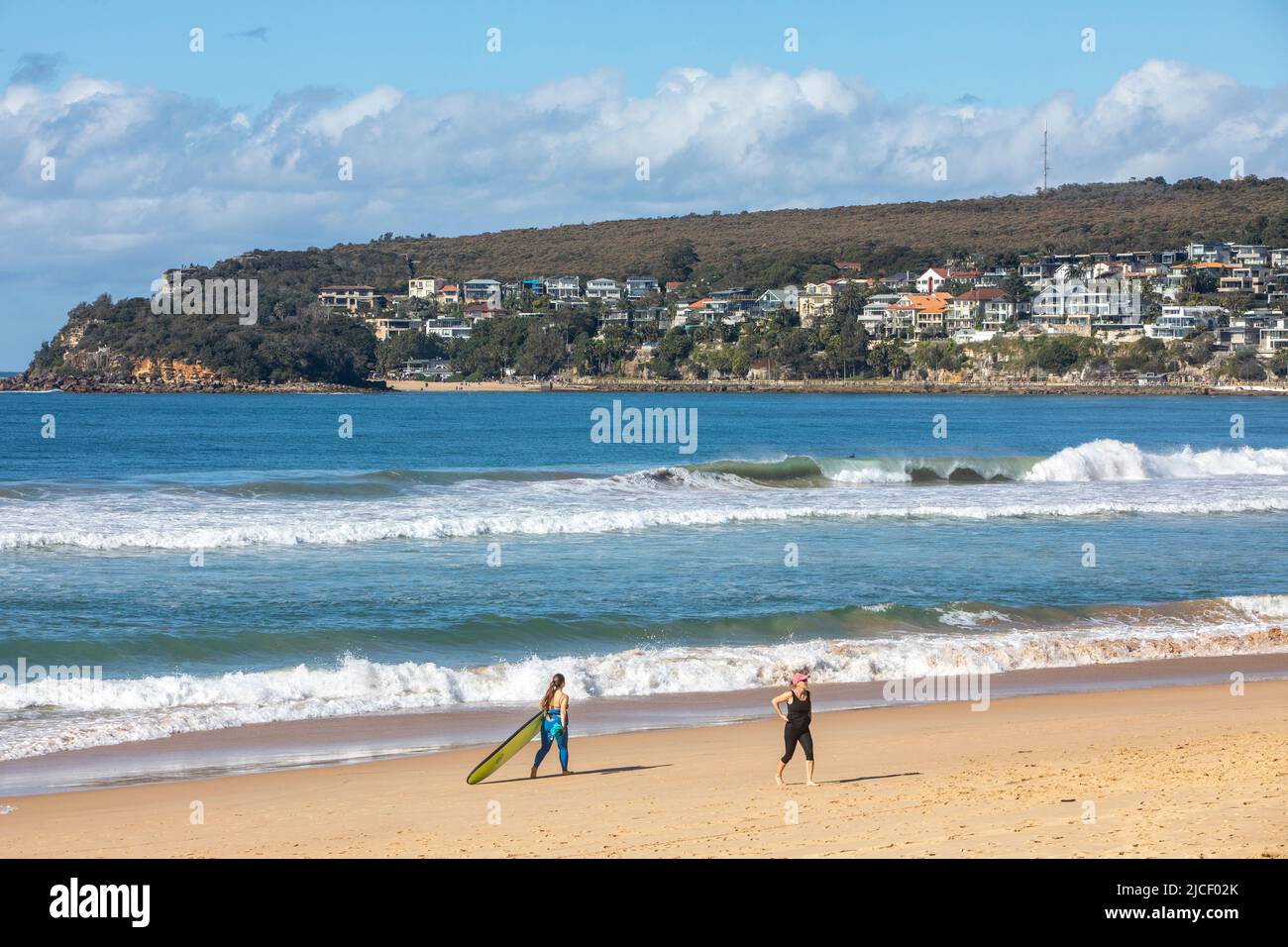 Manly Beach Sydney, female girl surfer carrying surfboard, other woman ...