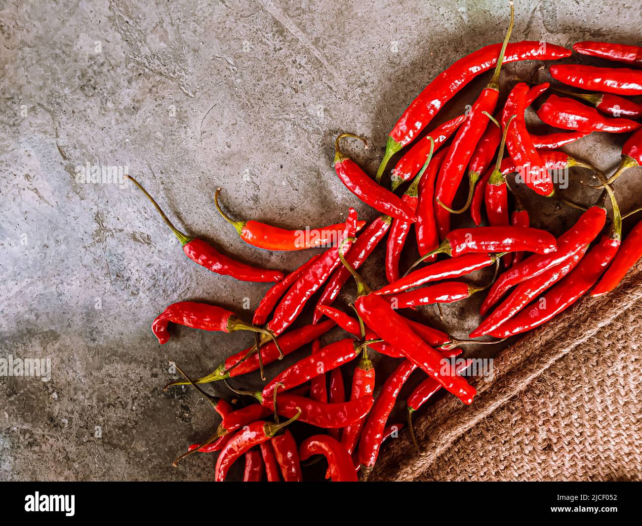 Fresh red chili peppers on vintage cloth background. fresh Red chilli ...