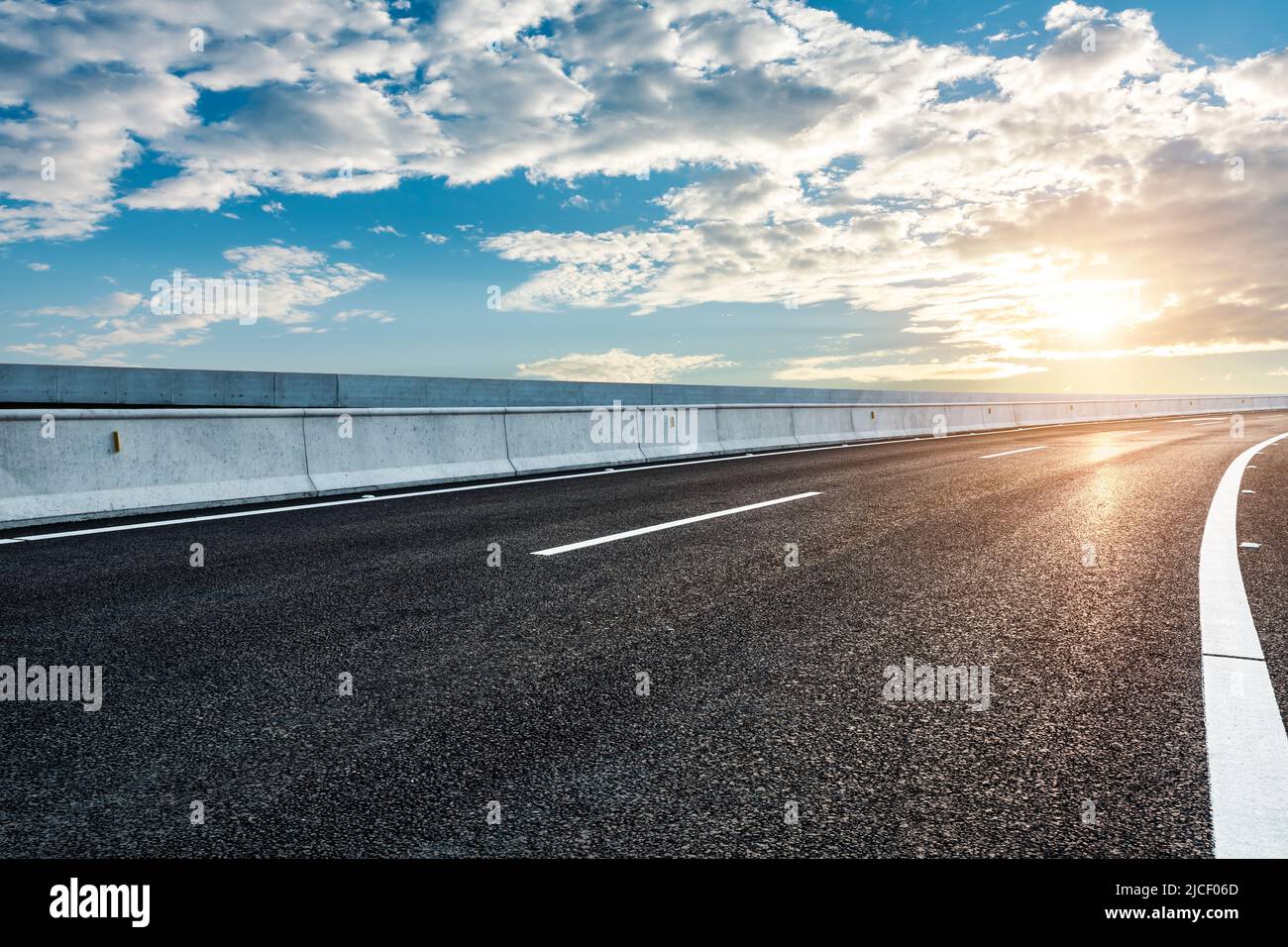 Empty asphalt road and sky clouds at sunrise Stock Photo - Alamy