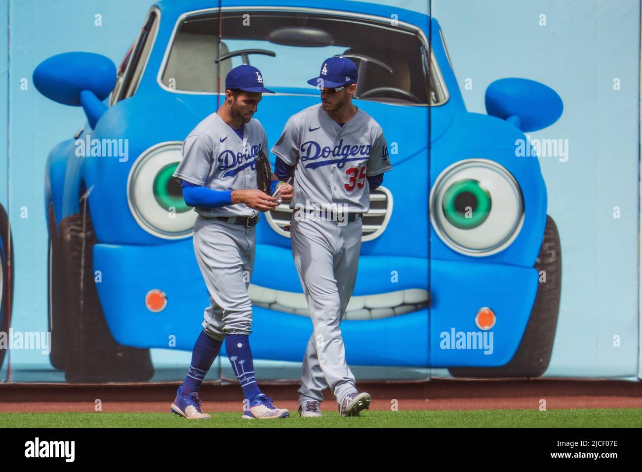 Los Angeles Dodgers designated hitter Chris Taylor (3) is checked on by ...