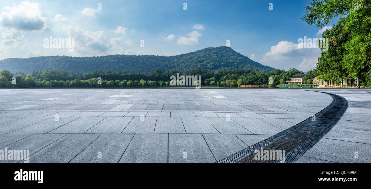 Empty square platform and green mountain with forest landscape in ...