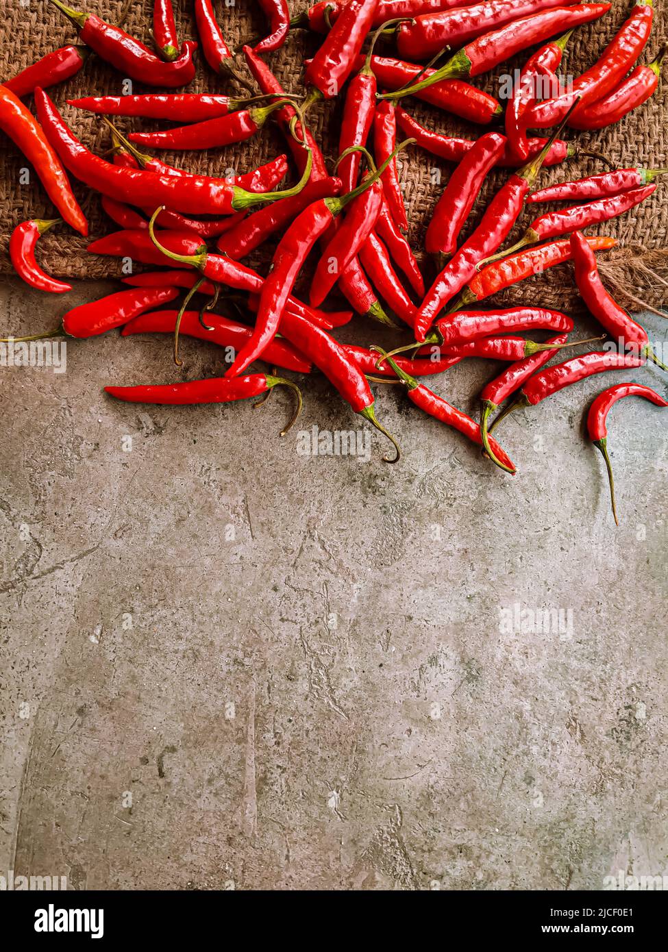 Fresh red chili peppers on vintage cloth background. fresh Red chilli ...