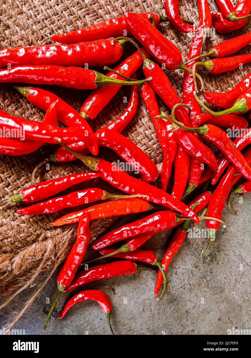 Fresh red chili peppers on vintage cloth background. fresh Red chilli ...