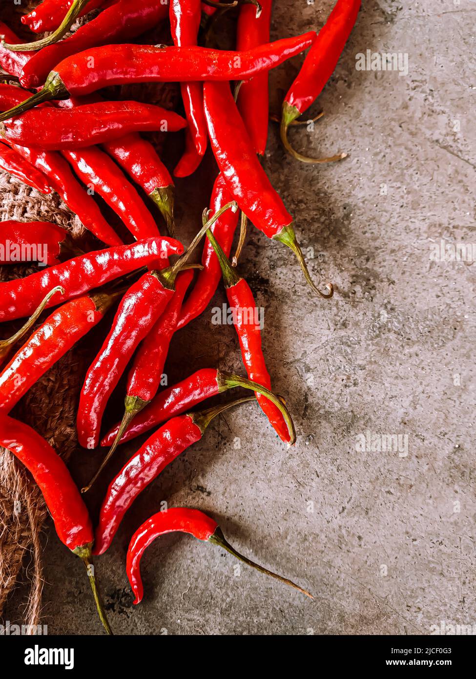 Fresh red chili peppers on vintage cloth background. fresh Red chilli ...