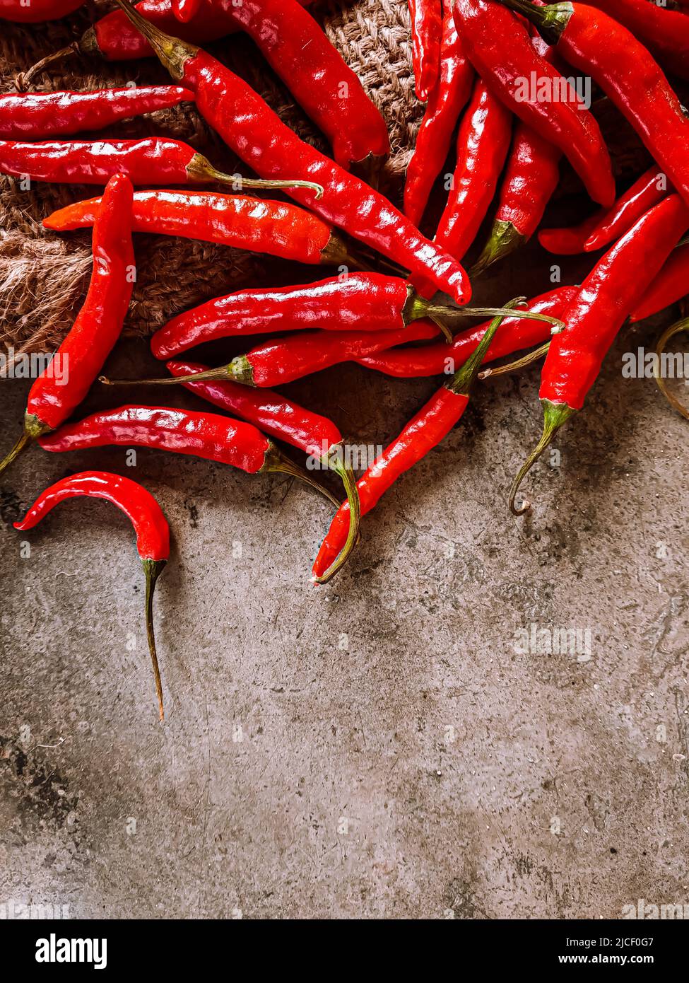 Fresh red chili peppers on vintage cloth background. fresh Red chilli ...