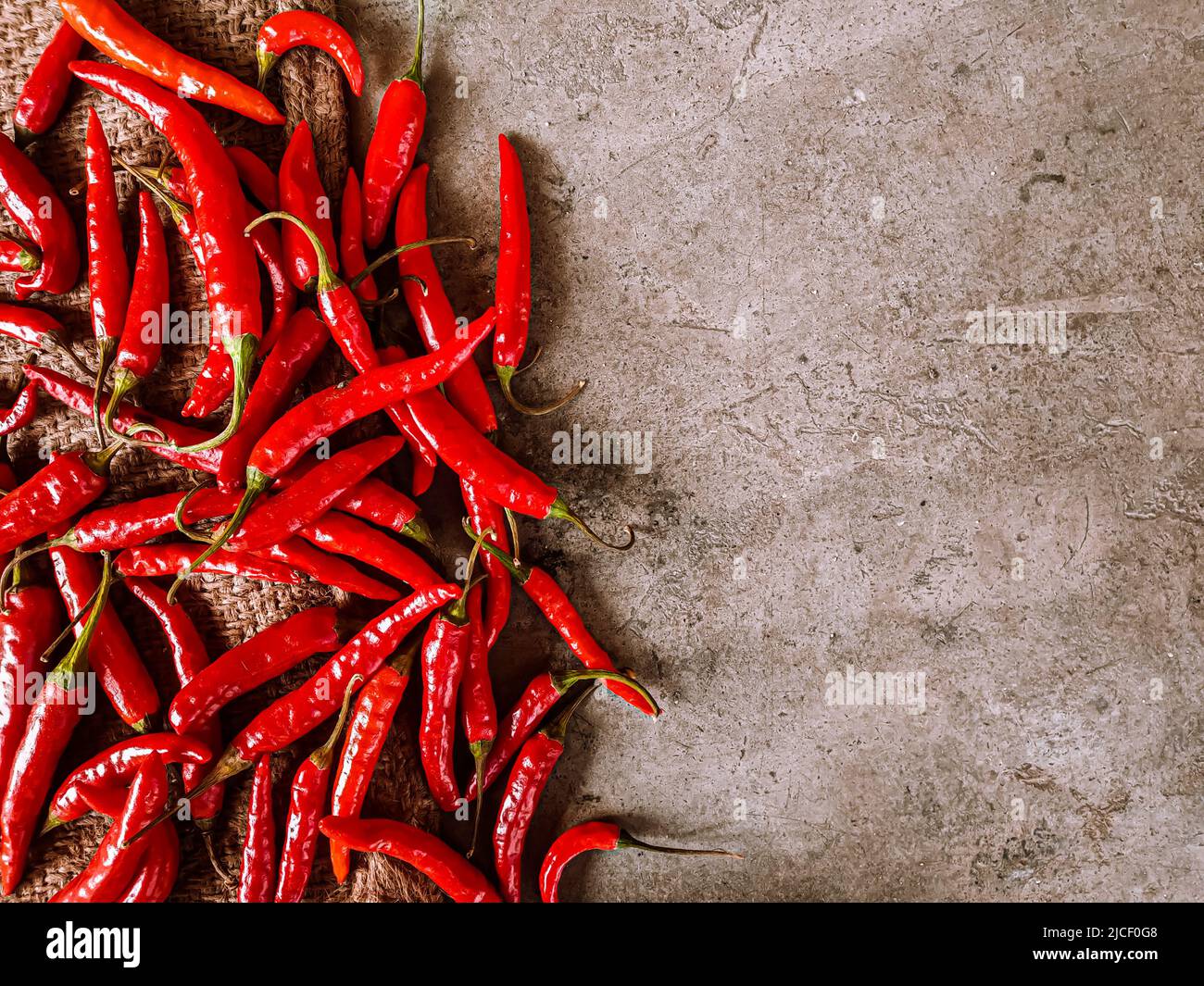 Fresh red chili peppers on vintage cloth background. fresh Red chilli ...