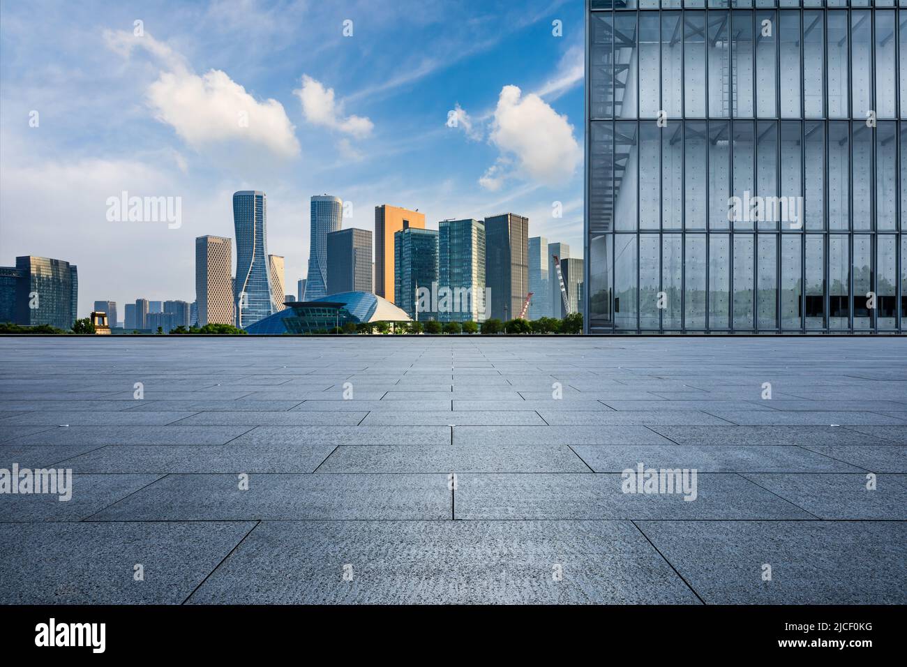 Empty square floor and city skyline with modern commercial buildings in ...