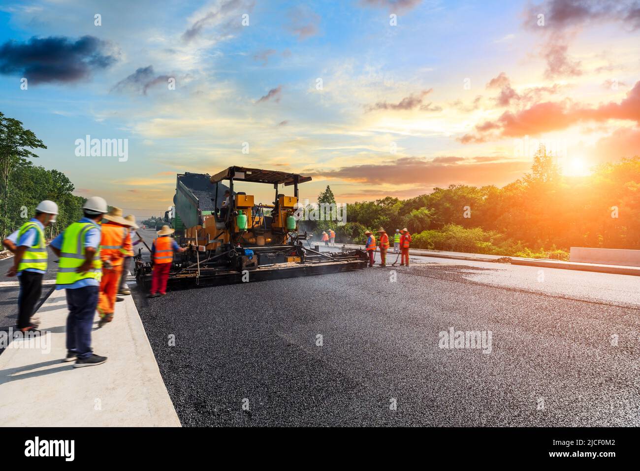 Construction site is laying new asphalt pavement, road construction ...