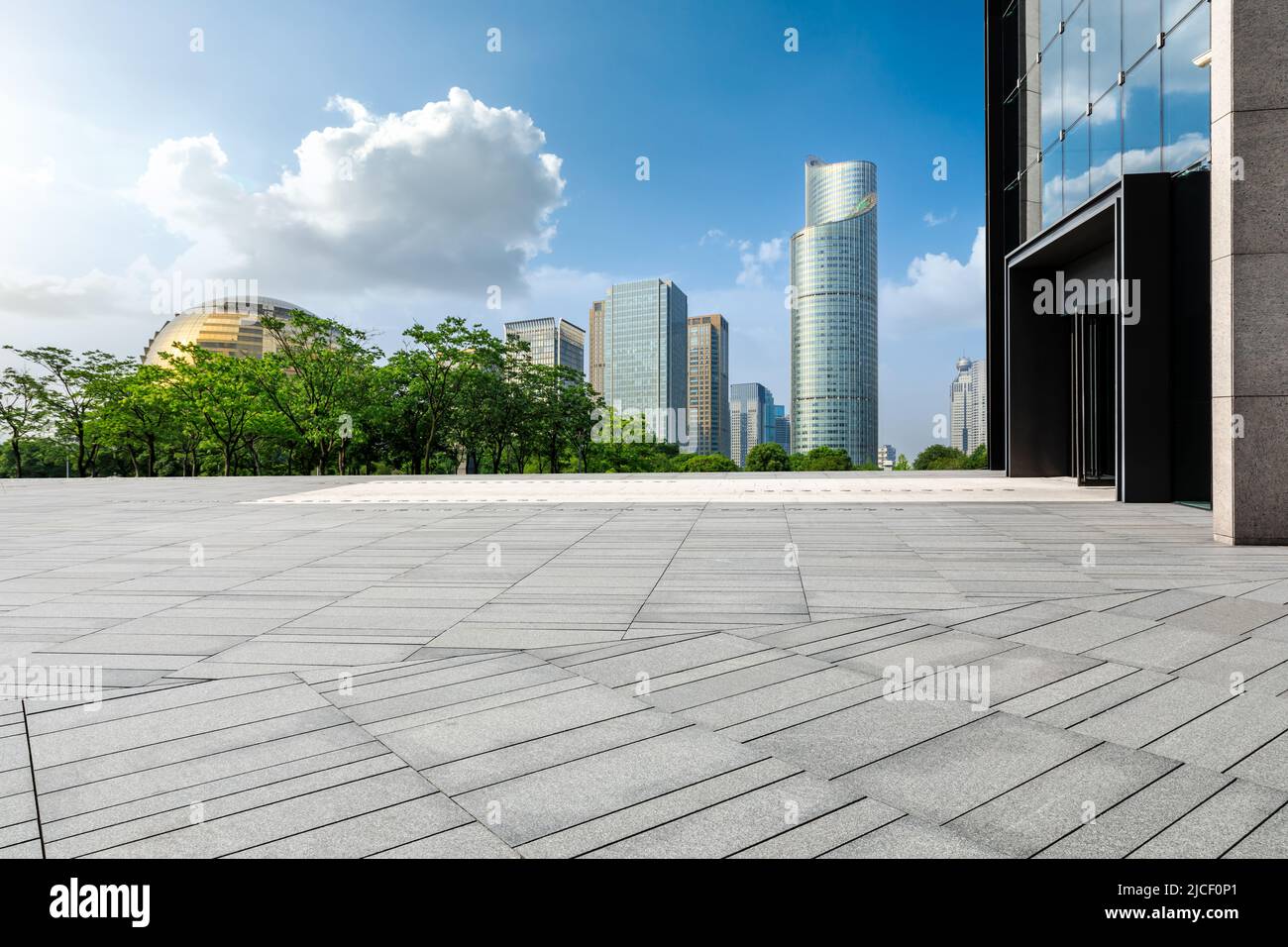 Empty square floor and city skyline with modern commercial buildings in ...