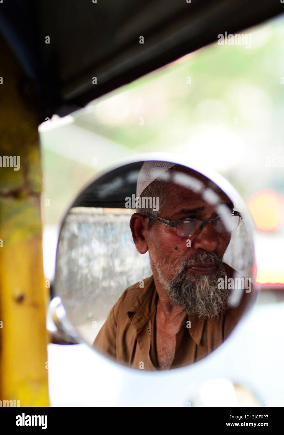 An Indian Muslim auto rickshaw driver in Mumbai, India Stock Photo - Alamy