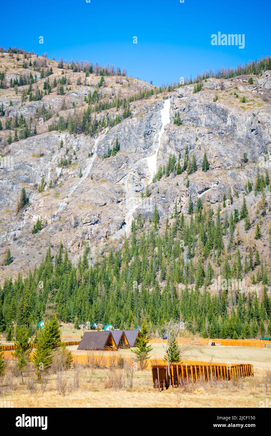 Scenic view with the beautiful mountain peaks, blue sky and the valley ...