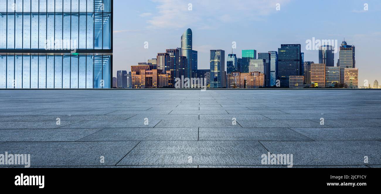Empty square floor and city skyline with modern commercial buildings in ...