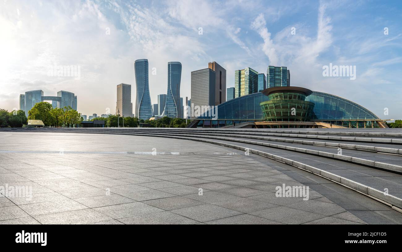 Empty square floor and city skyline with modern commercial buildings in ...