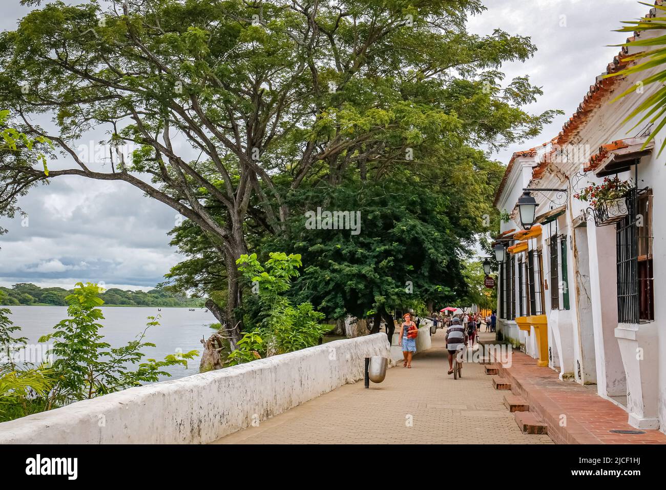 River promenade with typical historic houses, trees at Santa Cruz de ...