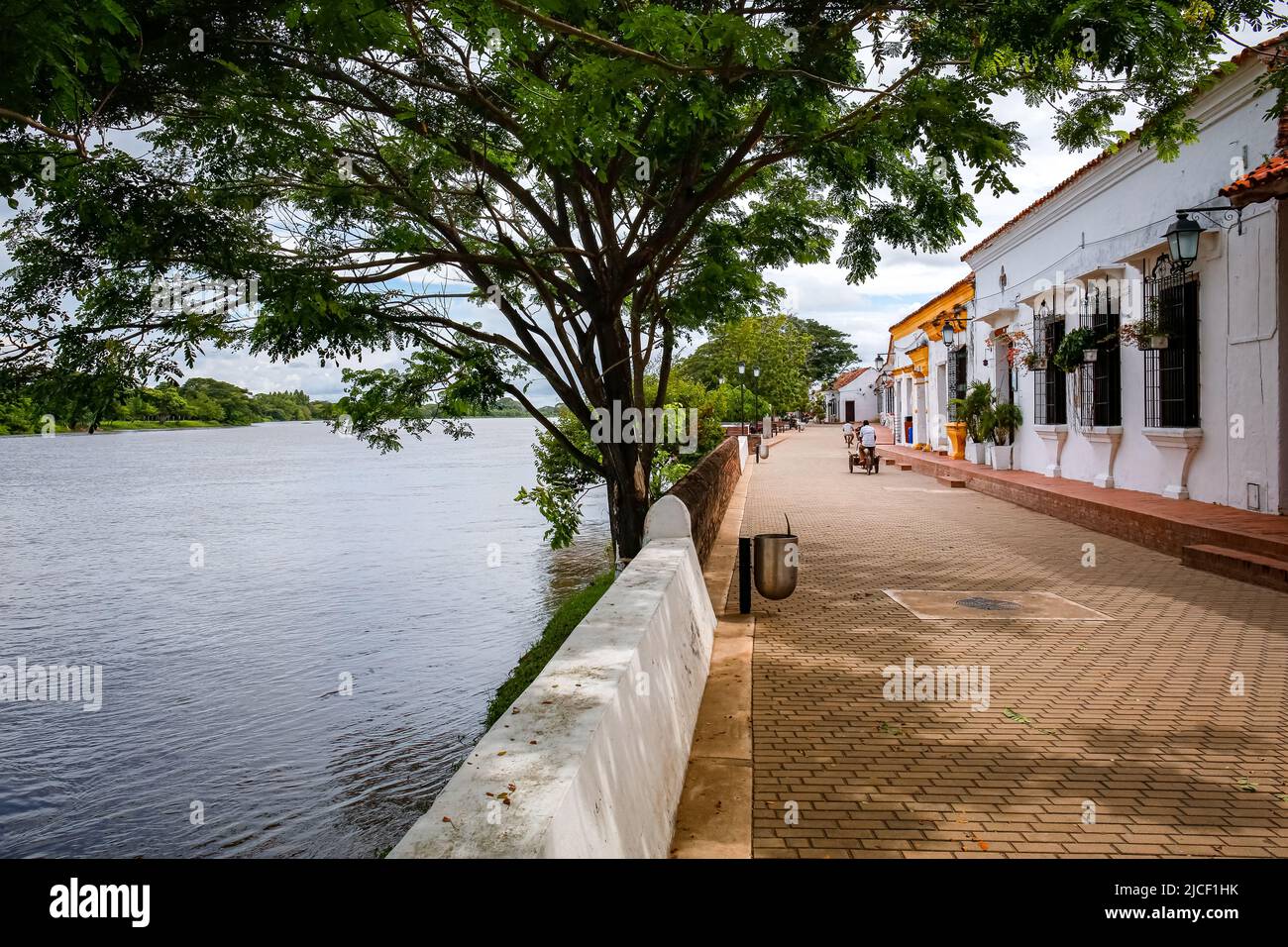River promenade with typical historic houses, trees at Santa Cruz de ...