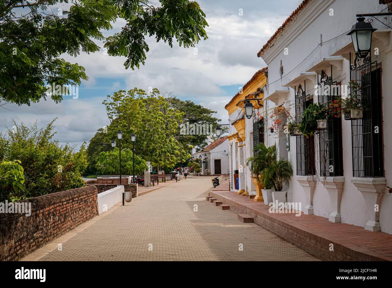 River promenade with typical historic houses, trees at Santa Cruz de ...