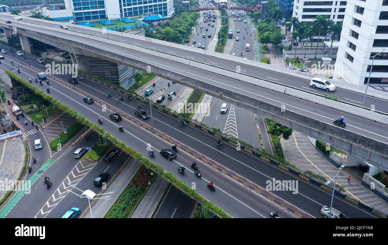 Highway multi-level interchange road with moving cars. Cars are moving ...