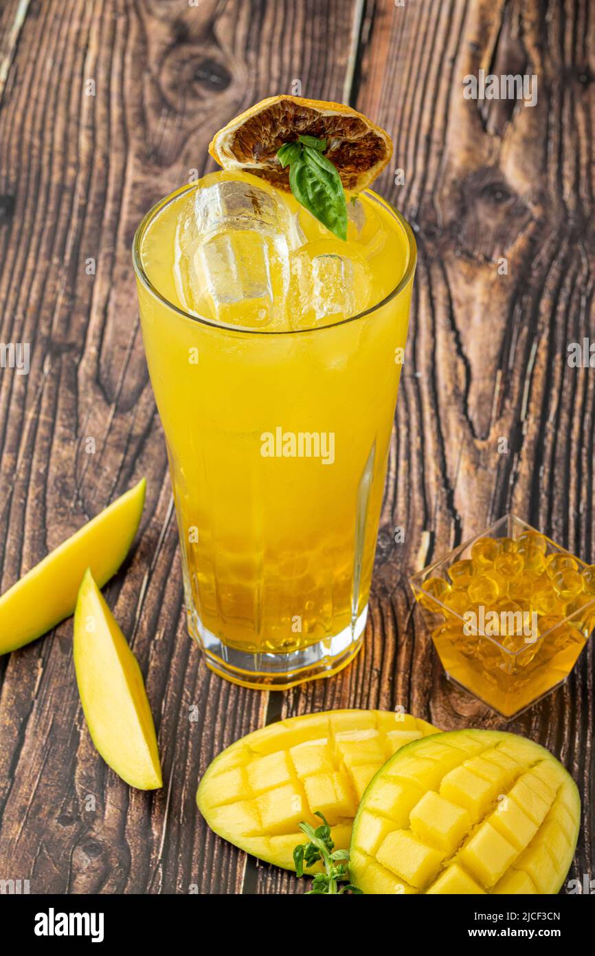 Mango lemonade with bubble tea on dark wooden background Stock Photo ...
