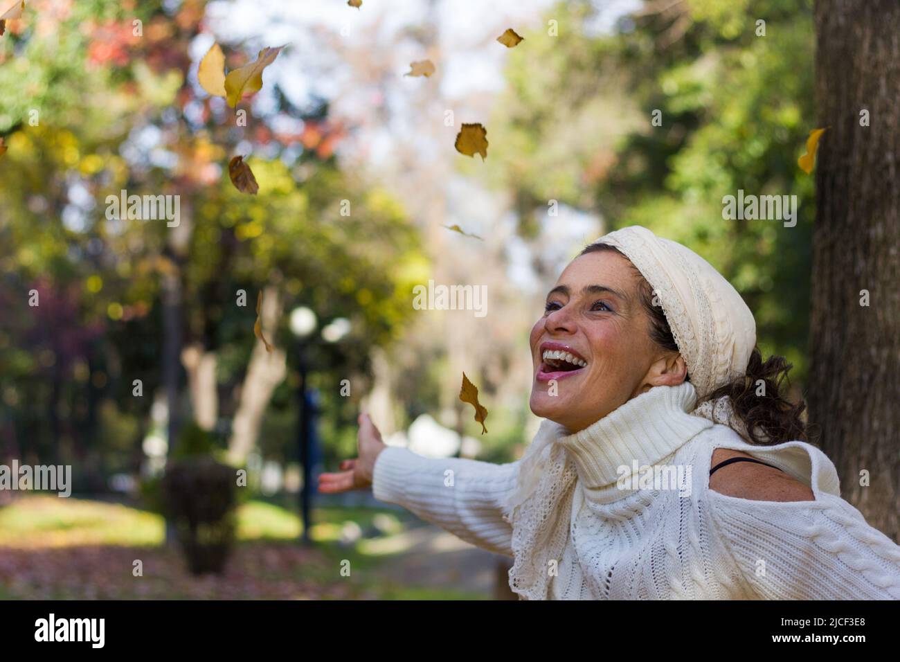 Enthusiastic loving middle aged lady with open arms staring at brown ...