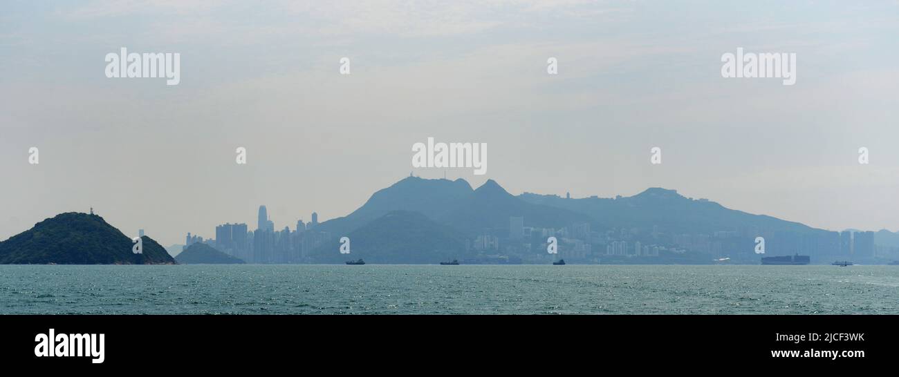 A Faraway view of Hong Kong island seen from Peng Chau island in Hong Kong Stock Photo - Alamy