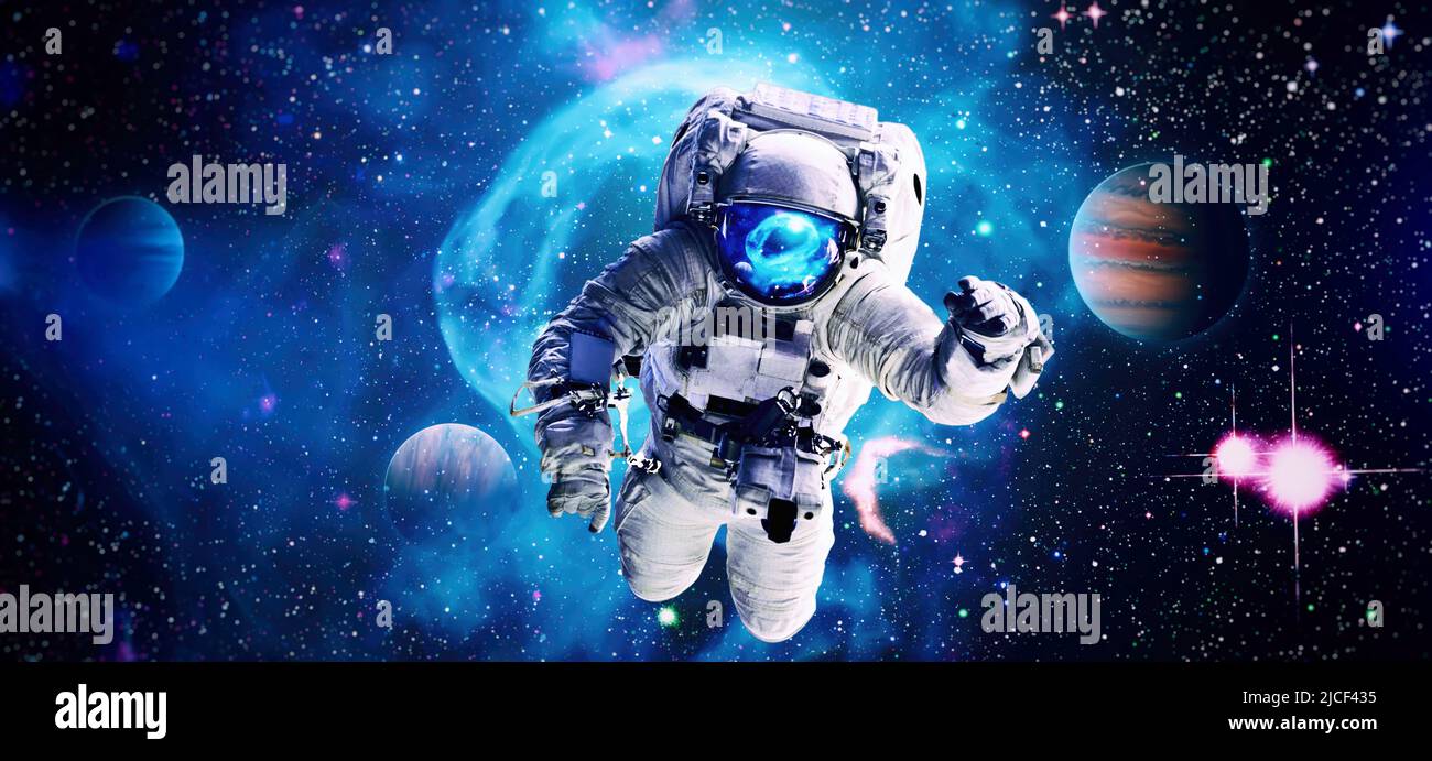 Astronaut in space in the solar system Earth. Blue light on background ...
