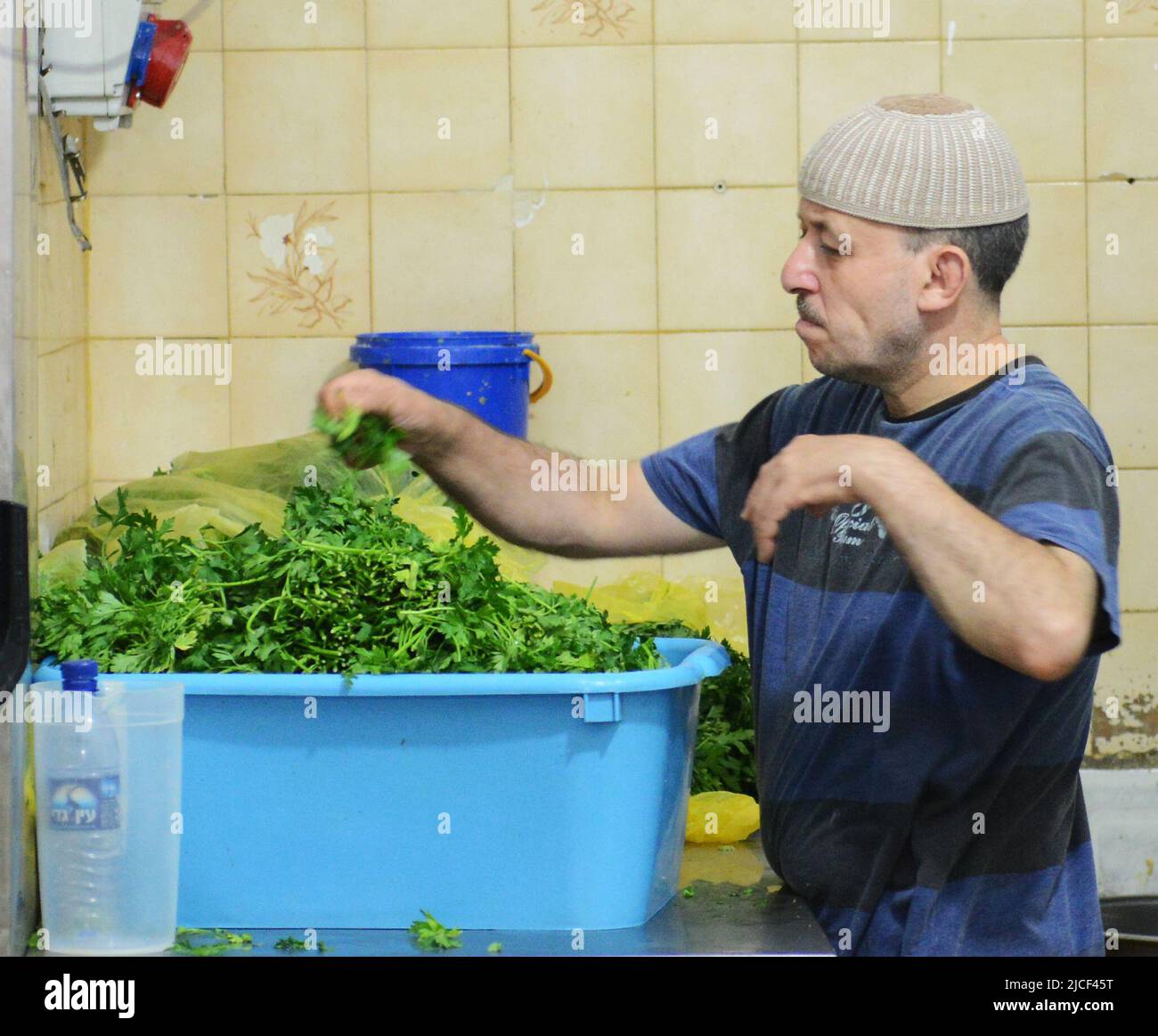 Falafel preparation at the Abu Shukri restaurant in the Muslim quarter ...