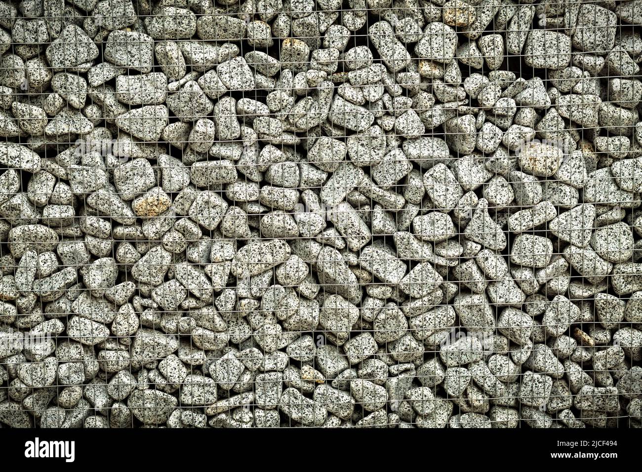 Textured background of a stone wall with iron netting Stock Photo - Alamy