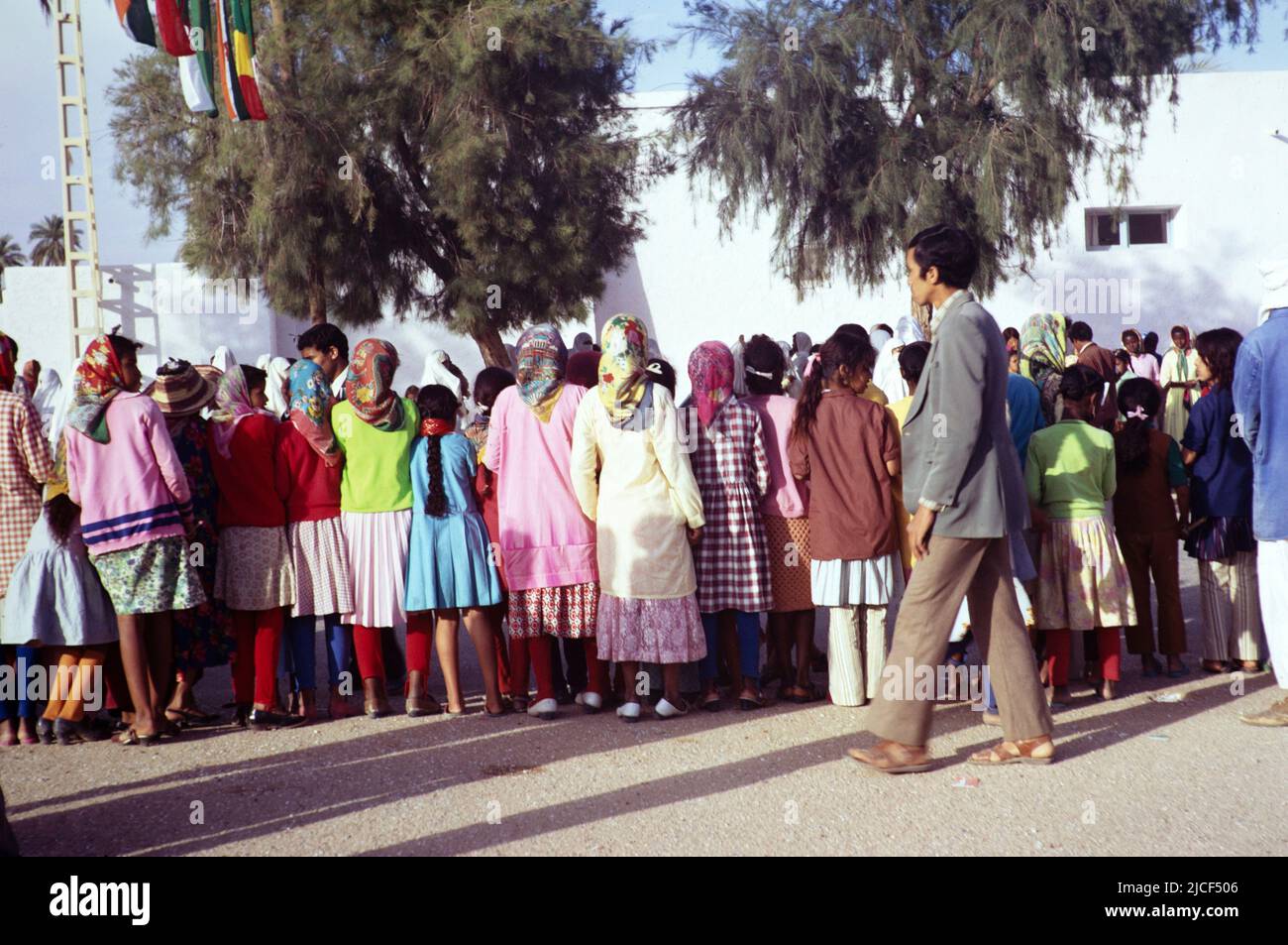 Women and girls waiting for the arrival of the president on a visit to ...