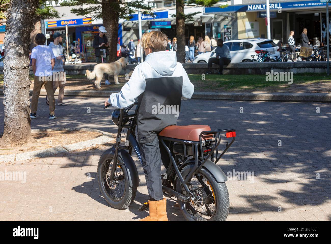 Australian teenage boy riding a Dirodi Rover electric e bike in Manly ...