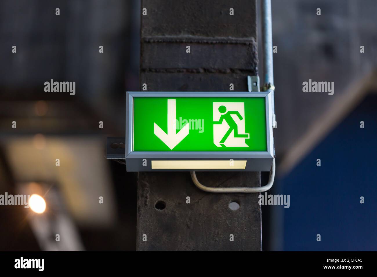 Essen, Germany - Mar 26, 2022: Emergency exit sign. Arrow pointing ...
