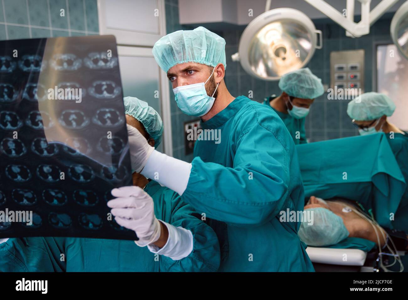 Healthcare and medical concept. Group of doctors looking at x-ray ...