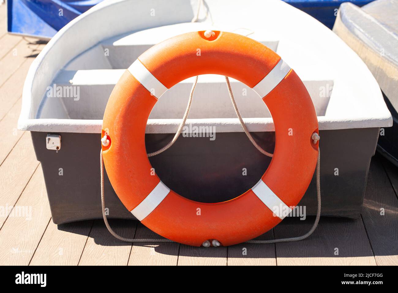 Pier with lifebuoy and boat. Boats for walking. Boats rental. Relax in ...