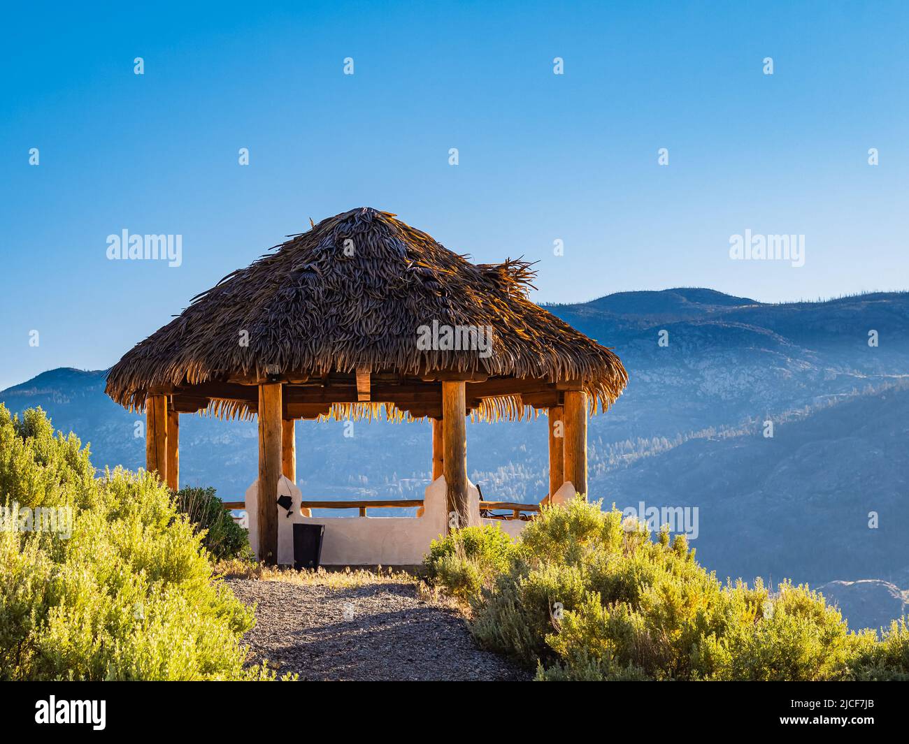 Wooden pergola at a beautiful green garden. Summer vacation, exotic ...
