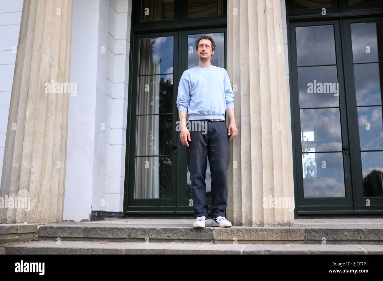Hamburg, Germany. 11th June, 2022. Actor Hans Löw stands by a column in ...