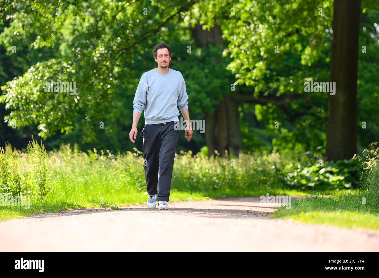 Hamburg, Germany. 11th June, 2022. Actor Hans Löw walks through ...
