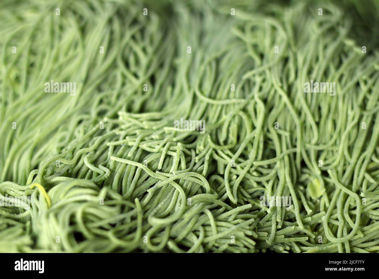 Raw homemade Italian green pasta spaghetti Stock Photo - Alamy