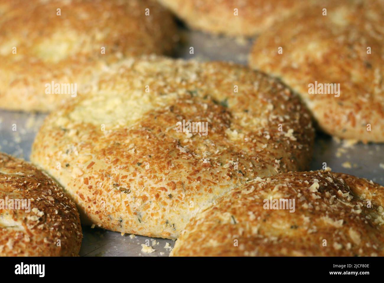Breads on tray with cheese topping Stock Photo - Alamy