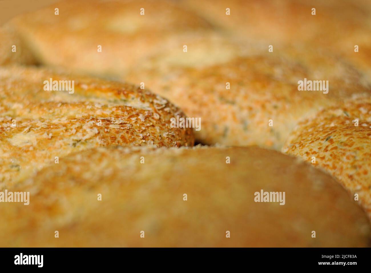 Breads on tray with cheese topping Stock Photo - Alamy