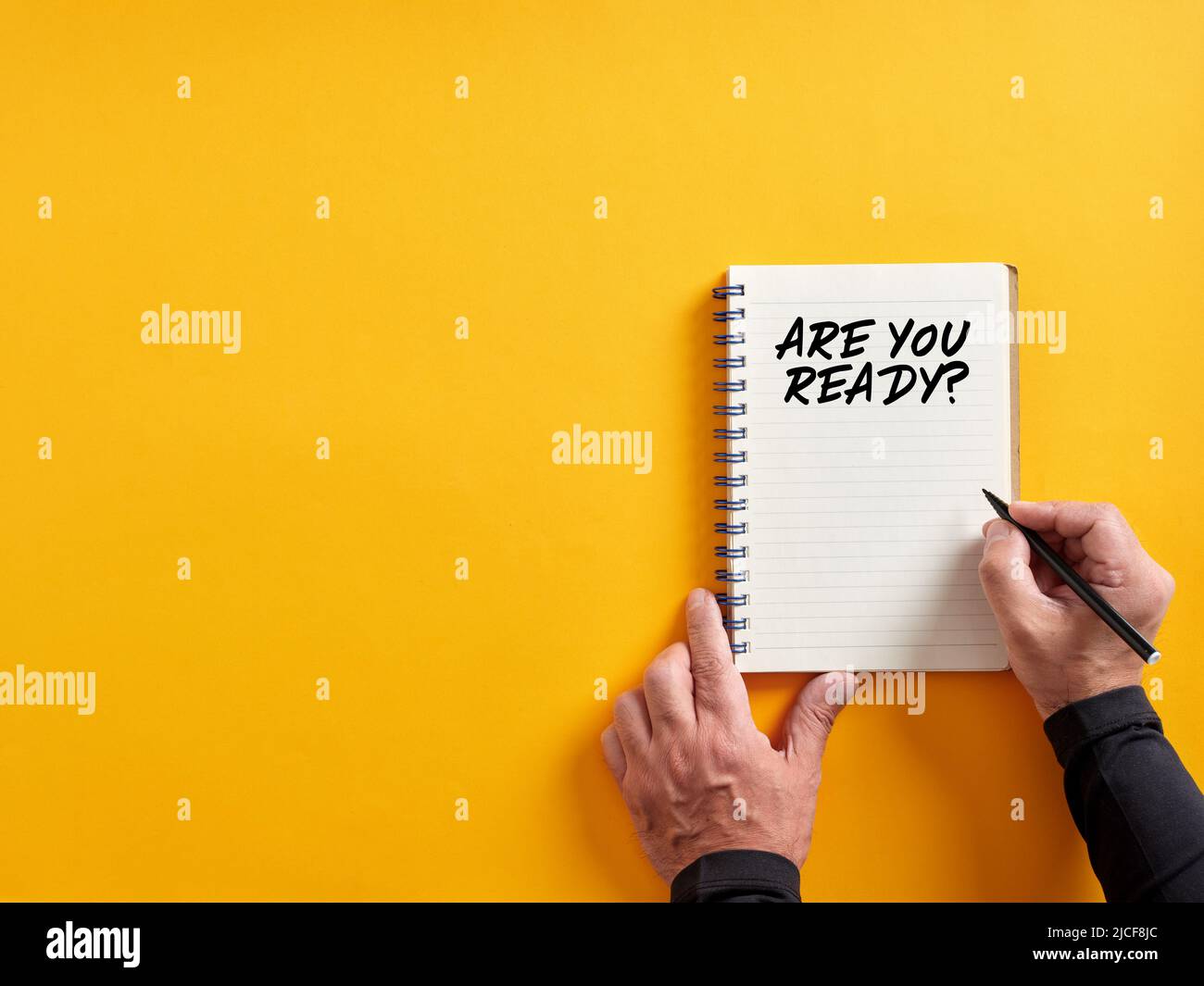 Male hand writing are you ready on a notepad. Are you ready concept ...