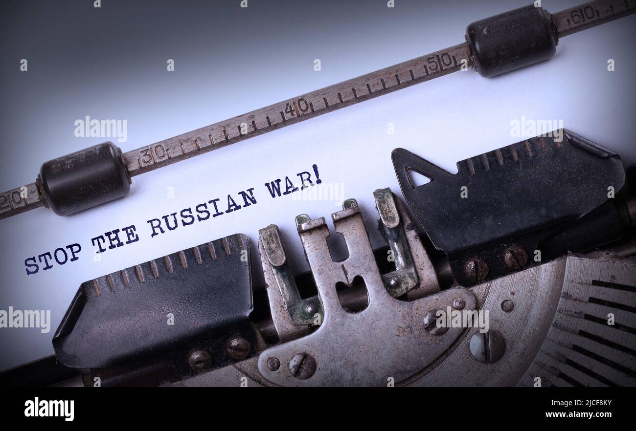 Very old typewriter with a clear message:Stop the war! Stock Photo - Alamy