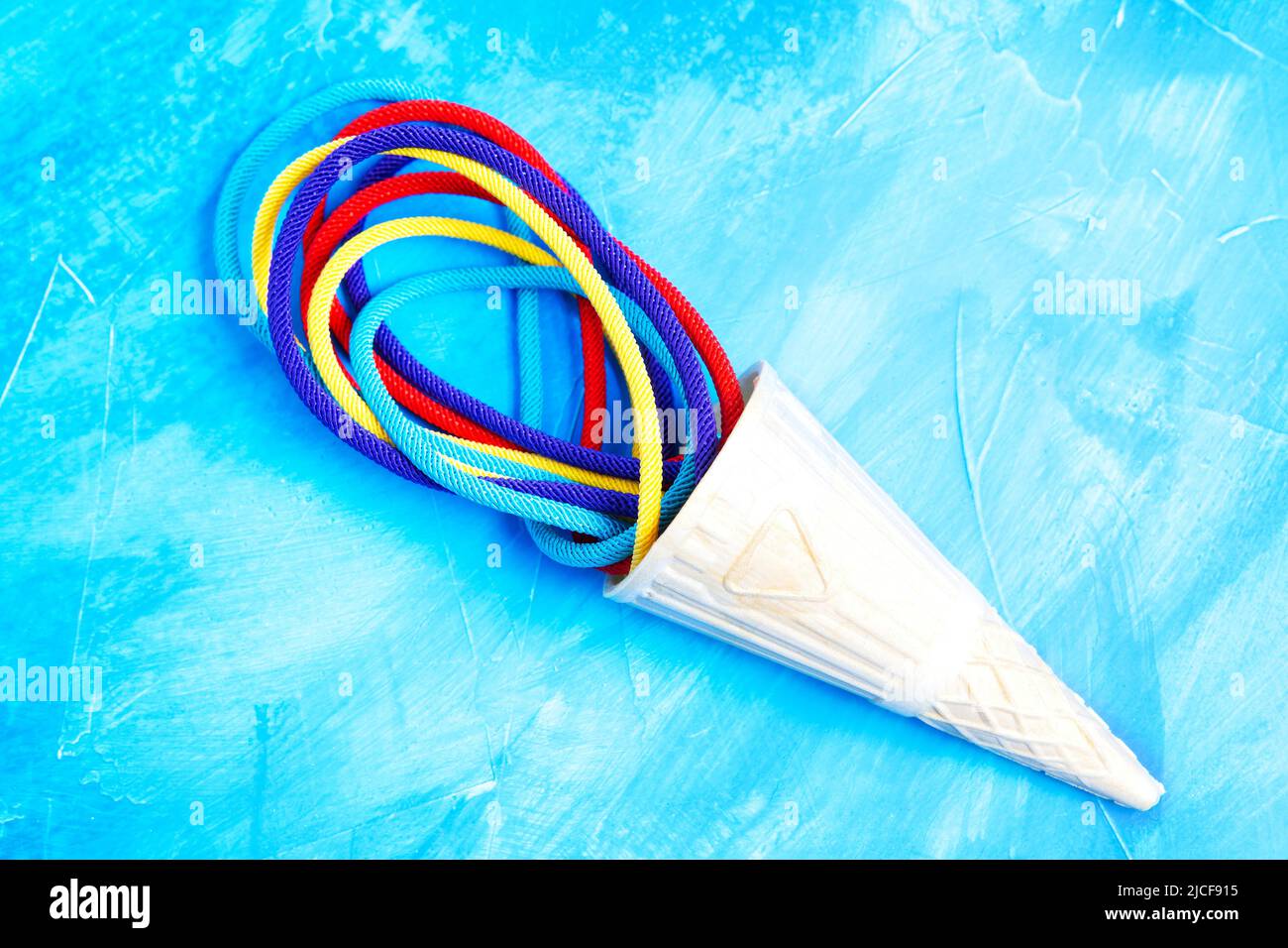 Multicolored braided cords in a waffle cone imitating ice cream ...